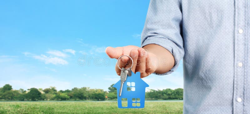 Real Estate Agent Handing Over House Keys in Hand Stock Photo - Image ...