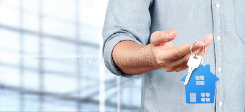 Real Estate Agent Handing Over House Keys in Hand Stock Photo - Image ...