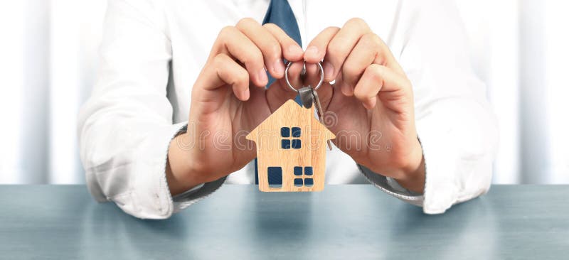 Real Estate Agent Handing Over House Keys in Hand Stock Photo - Image ...