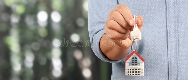 Real Estate Agent Handing Over House Keys in Hand Stock Image - Image ...