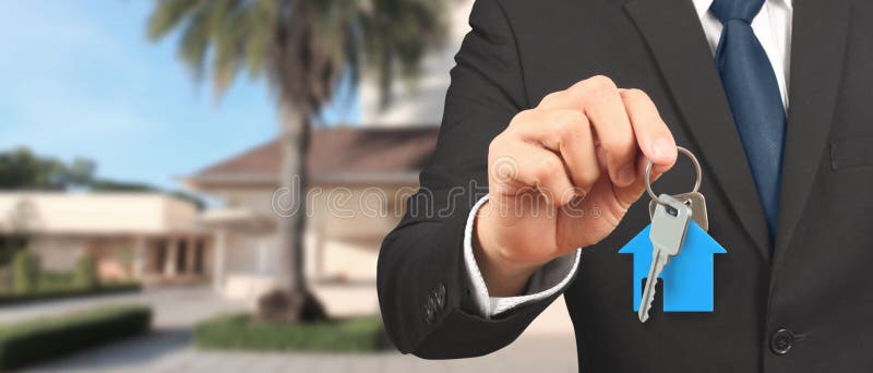 Real Estate Agent Handing Over House Keys in Hand Stock Image - Image ...