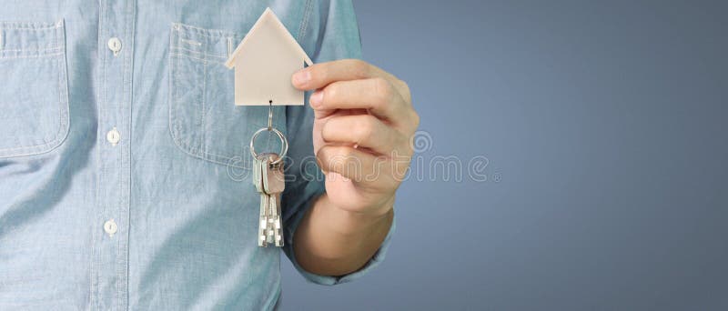 Real Estate Agent Handing Over House Keys in Hand Stock Photo - Image ...