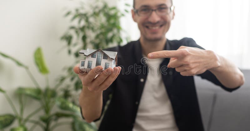 Real Estate Agent Holding a Toy House. Stock Image - Image of concept ...