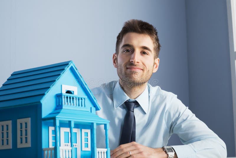 Real Estate Agent with Model House Stock Photo - Image of young, real ...