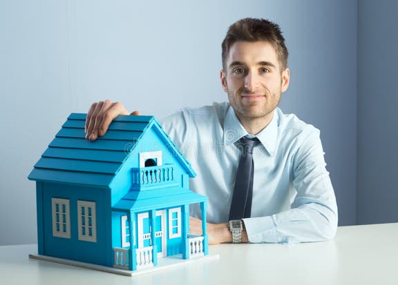 Real Estate Agent with Model House Stock Photo - Image of person ...