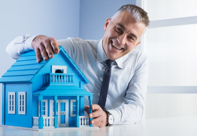 Real Estate Agent with Model House Stock Photo - Image of happy, agent ...