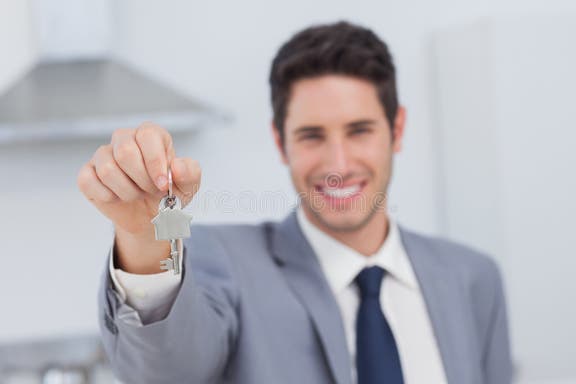 Real Estate Agent Presenting House Key Stock Image - Image of house ...
