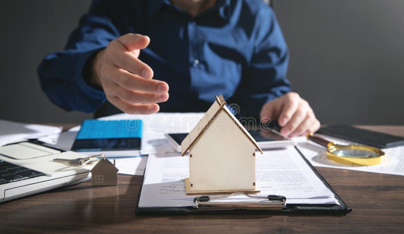 Real Estate Agent Showing House Model Stock Photo - Image of apartment ...
