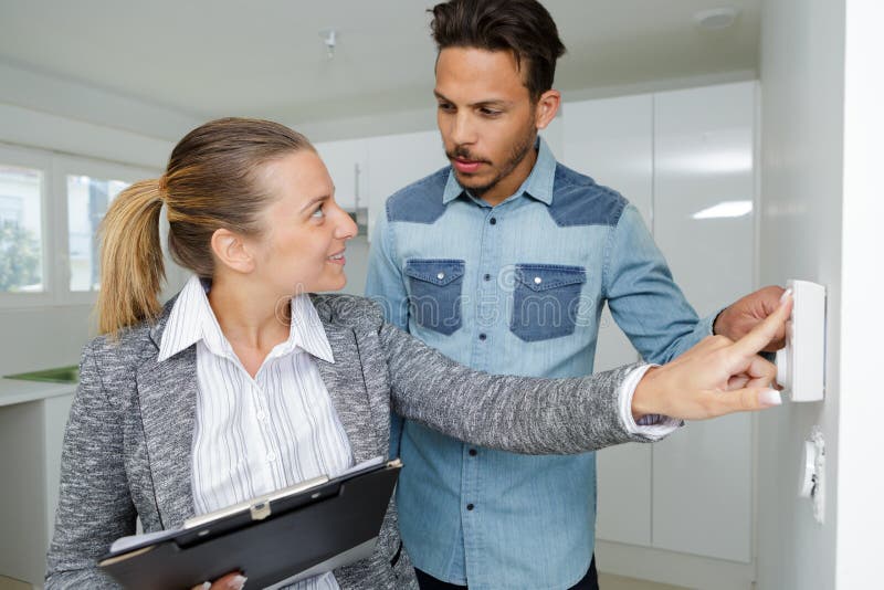 Real Estate Agent Showing Temperature Control Stock Photo - Image of ...