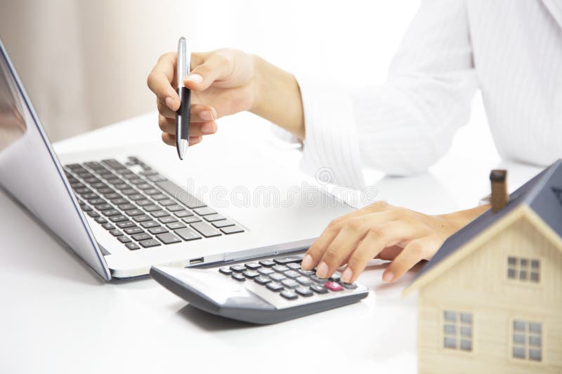 Real Estate Agent Working with Laptop at Table in Office.hand Using ...