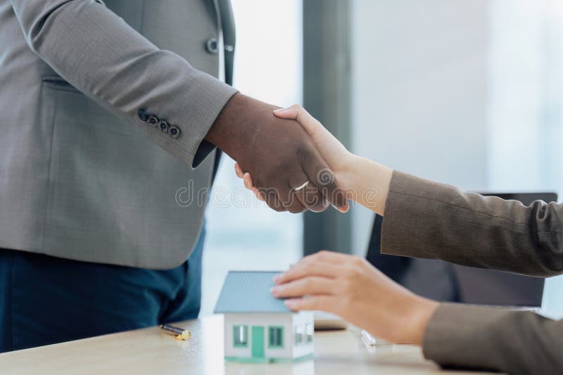Real Estate Broker Agent Manager Shaking Hands with a Client after ...