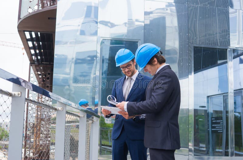 Real Estate Developers in Helmets. New Office Construction Stock Photo ...