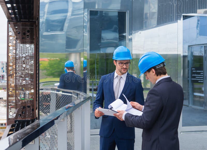 Real Estate Developers in Helmets. New Office Construction Stock Photo ...