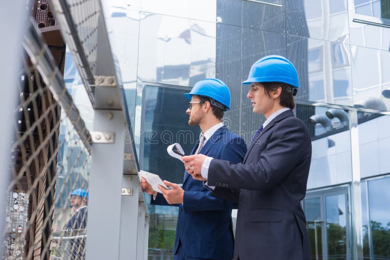 Real Estate Developers in Helmets. New Office Construction Stock Photo ...