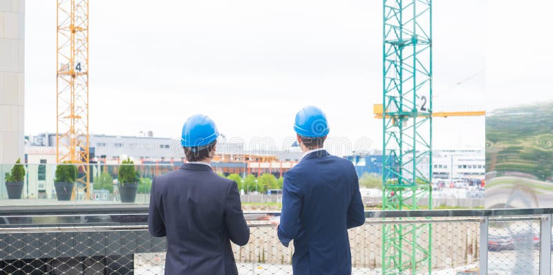 Real Estate Developers in Helmets. New Office Construction Stock Photo ...
