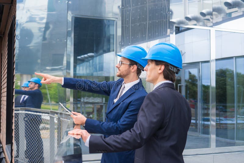Real Estate Developers in Helmets. New Office Construction Stock Image ...