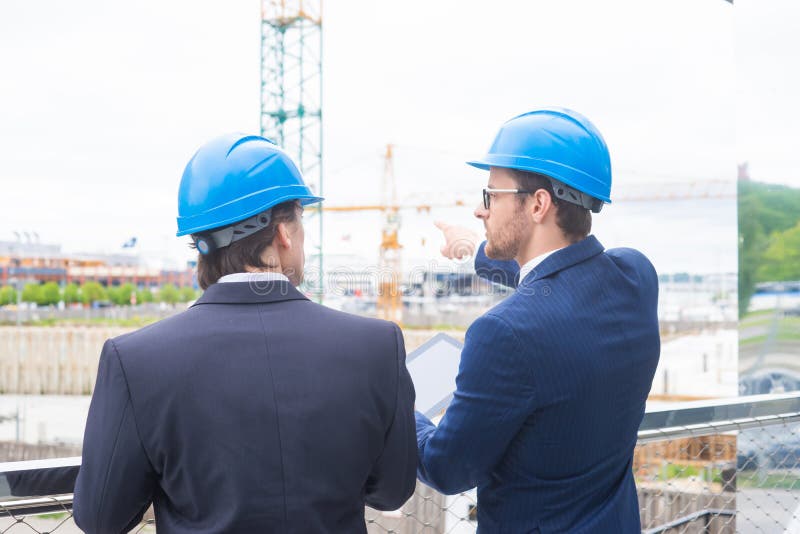 Real Estate Developers in Helmets. New Office Construction Stock Photo ...