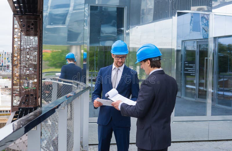 Real Estate Developers in Helmets. New Office Construction Stock Photo ...