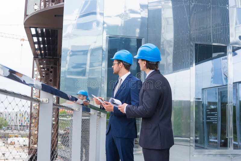 Real Estate Developers in Helmets. New Office Construction Stock Photo ...