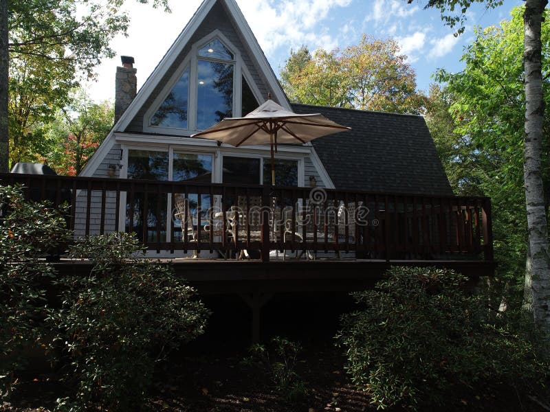 Real Estate a Frame House on Lake Stock Photo - Image of symmetric ...