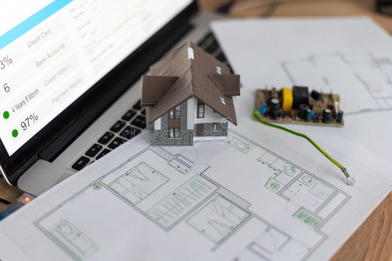 A Real Estate Model and a Computer are on the Table. Stock Photo ...