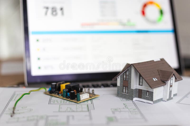 A Real Estate Model and a Computer are on the Table. Stock Photo ...