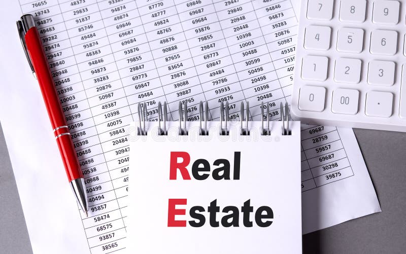 REAL ESTATE Text on Notebook with Chart , Pen and Calculator Stock ...