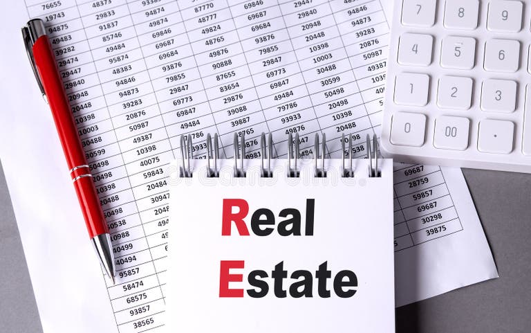 REAL ESTATE Text on Notebook with Chart , Pen and Calculator Stock ...