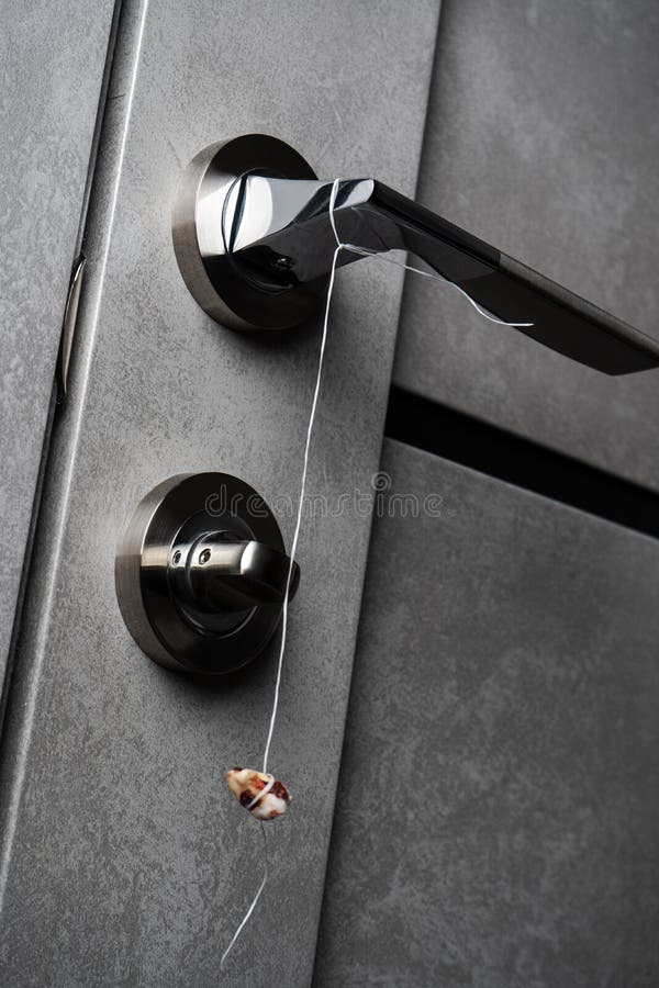 Real Human Teeth Hanging on the Door Handle. Pulled Out Tooth ...