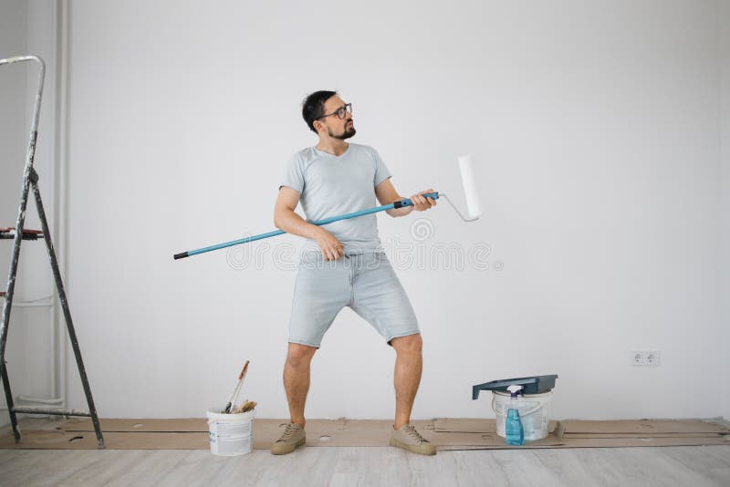 Instead of Real Microphone, Guy Using into a Mop and a Paint Roller ...
