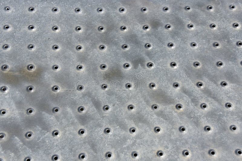 Real Perforated Stainless Metal Sheet in Construction. Metal Mesh with ...