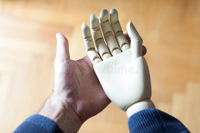 Real Hand Holding Prosthetic Hand Stock Image - Image of finger ...