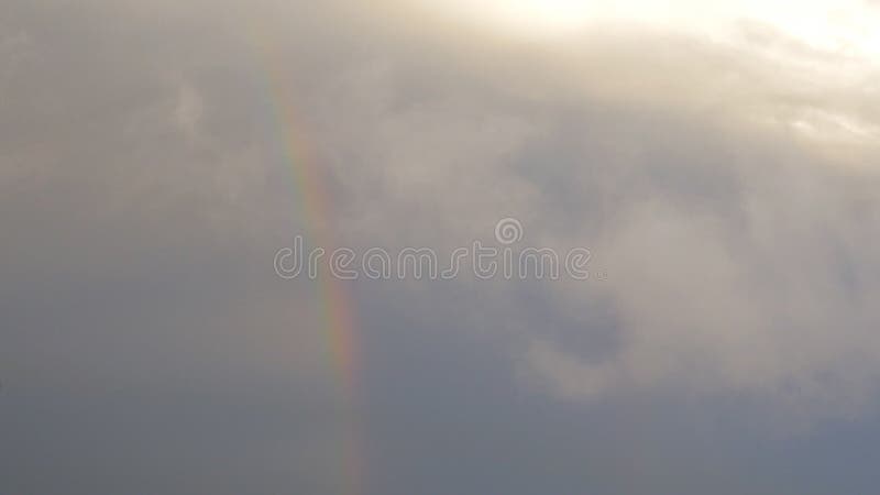 Real rainbow in clouds. stock video. Video of natural - 123513847