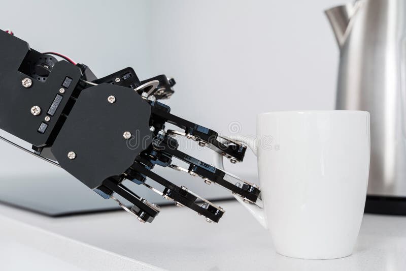 Real Robot Hand and White Cup of Coffee. Concept of Robotic Process ...