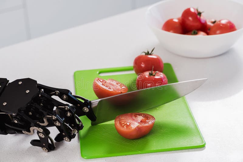 Real Robot S Hand Cutting Fresh Tomatoes with Sharp Knife. Concept of ...