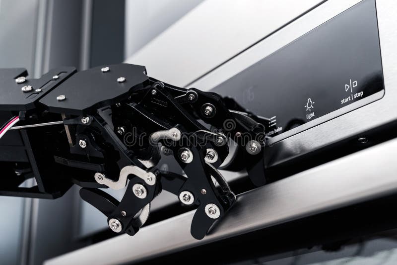 Real Robot S Hand and Electric Oven. Concept of Robotic Process ...