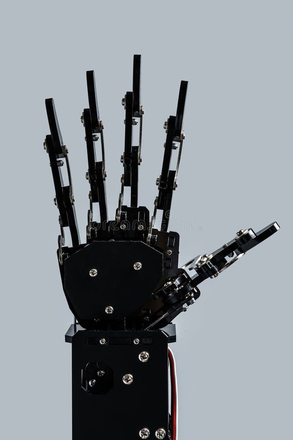 Real Robot Hand with Spoon and White Cup of Coffee. Concept of Robotic ...