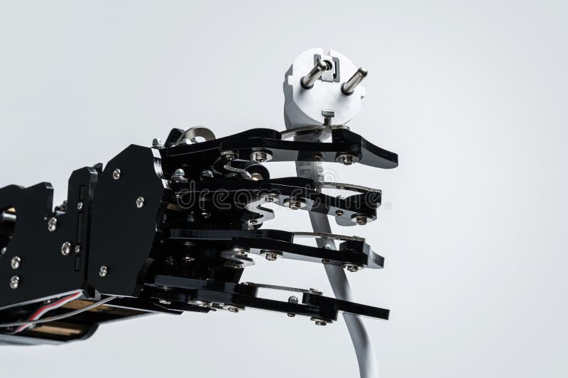 Real Robotic Hand with Power Plug. Concepts of AI Takeover and ...