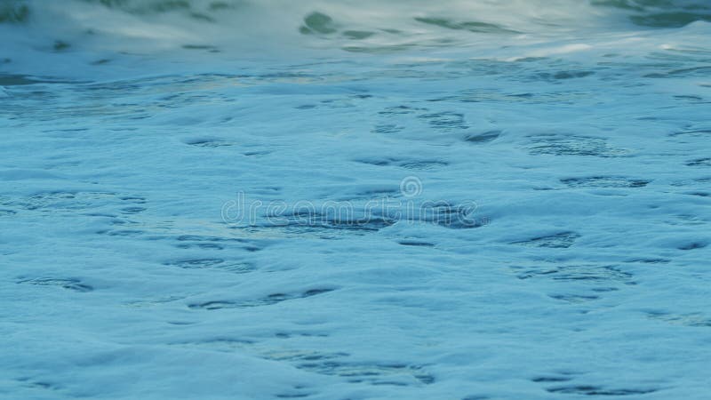 Element of Nature. White Wave Bubble Hits Fine Beach. Cinematic ...