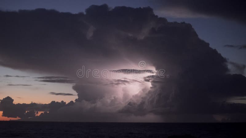 Lightning Flashes Illuminate The Night Sky During Thunderstorm Stock