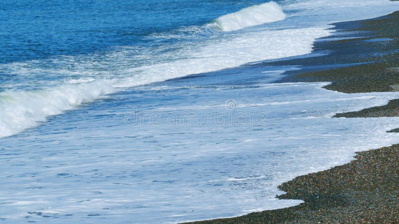 White Foam Wave Beaching on Sea Shore Pebble. Pebble Beach Foam Sea ...