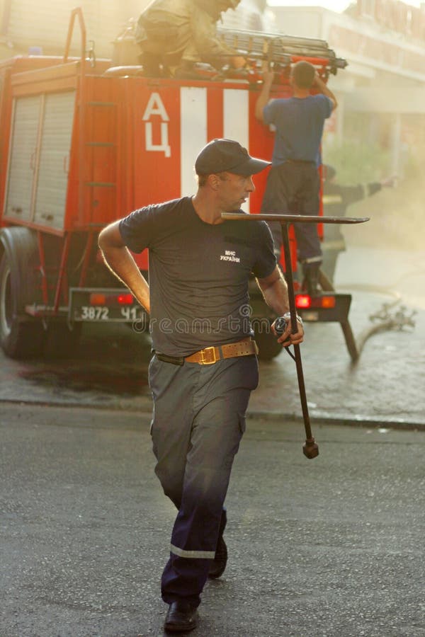 The Real Work of Firefighters at the Scene. Extinguishing a Burning ...