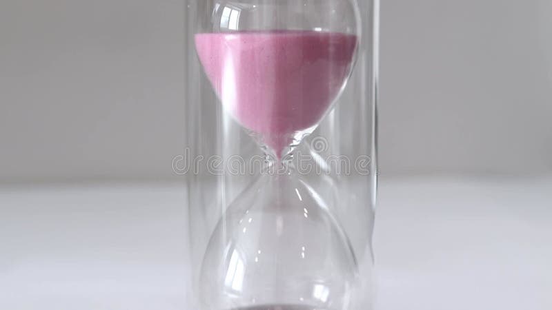 Realistic Hourglass with Pink Sand, Flowing Animation on White ...