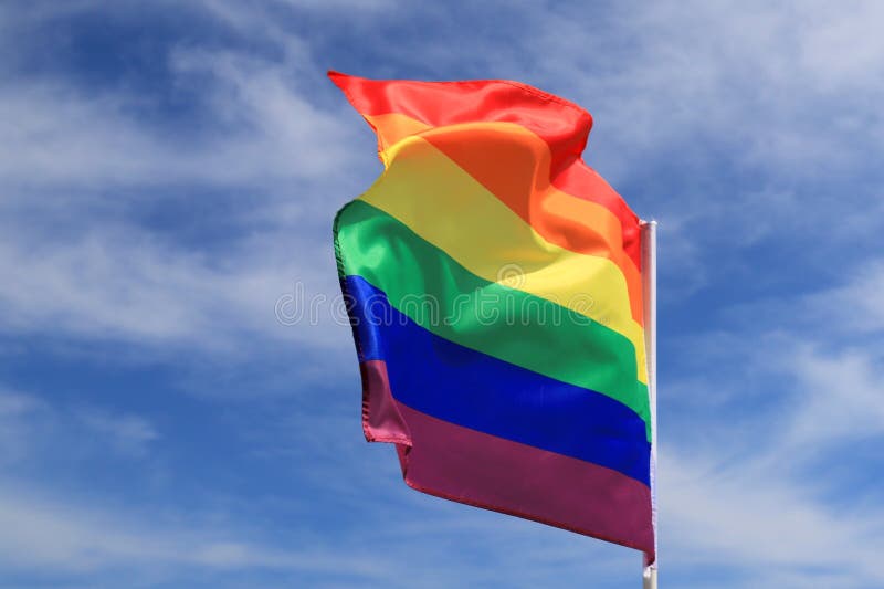 Realistic Rainbow Flag Of Lgbt Organization Waving Against Sky Lgbt