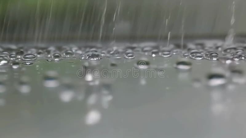Water Droplets Falling on a Surface during Rain Stock Video - Video of ...