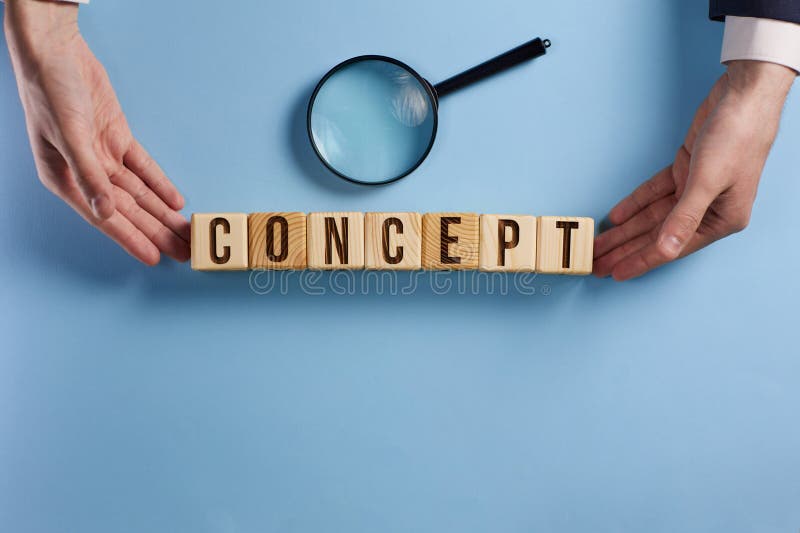 Realistic Wooden Blocks with Concept Word on Blue Table Stock Photo ...