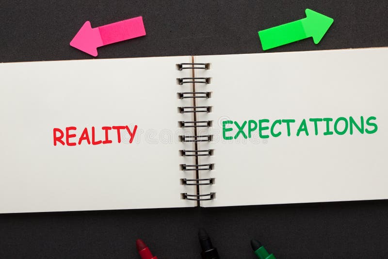 EXPECTATIONS VS REALITY - Word on Blue Paper on a Light Background with ...