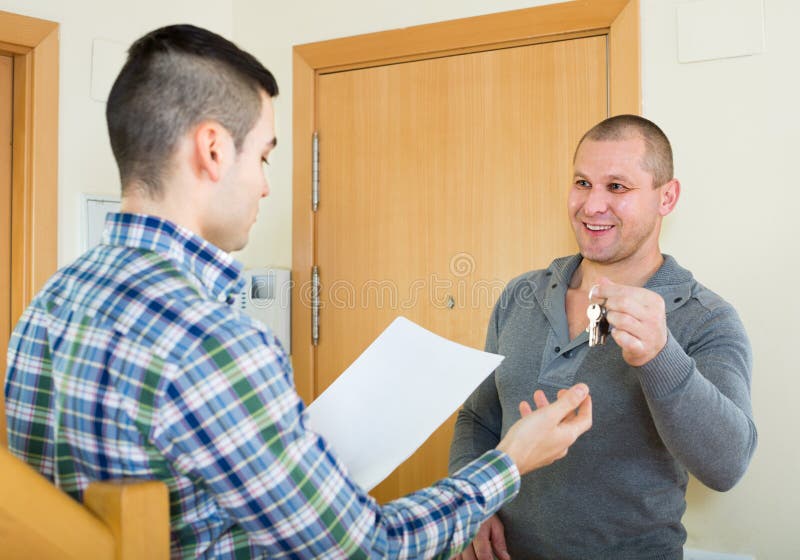 Realtor Giving Keys To Flat Owner Stock Photo - Image of deal, paper ...