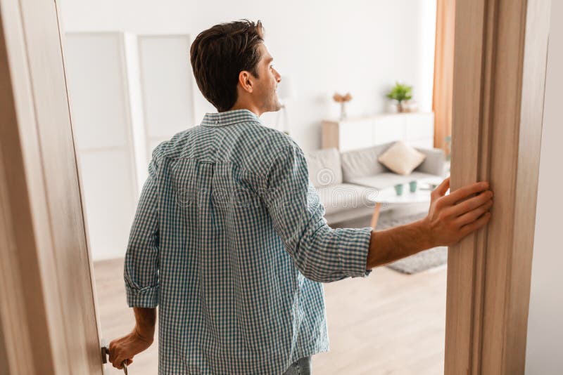Back View of Excited Young Man Walking in Apartment Stock Image - Image ... Back View of Excited Young Man Walking in Apartment Stock Image - Image ...