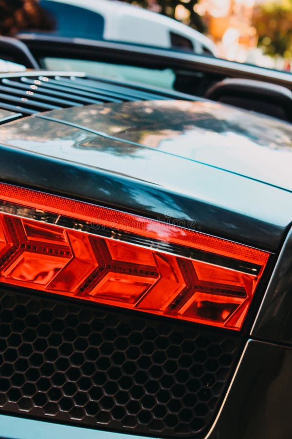 The Rear Car Lights of a Luxury Car. the Rear Luxury Car Lights Stock ...